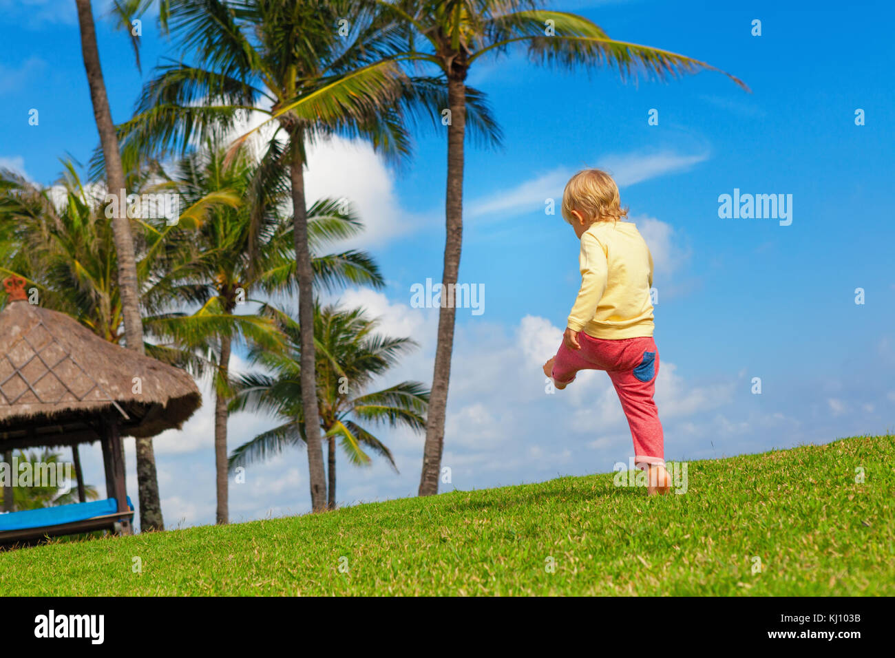Happy child have fun at outside walk without parents. Active boy run ...