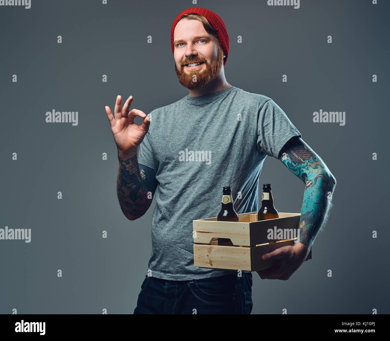 A man holds a wooden box with beer bottles Stock Photo - Alamy