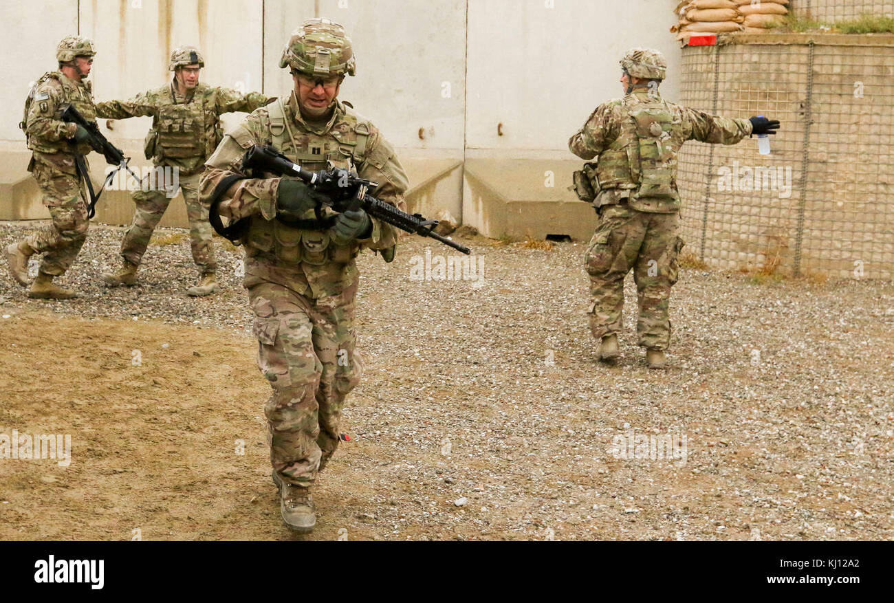 Soldiers run to their firing positions during a marksmanship ...