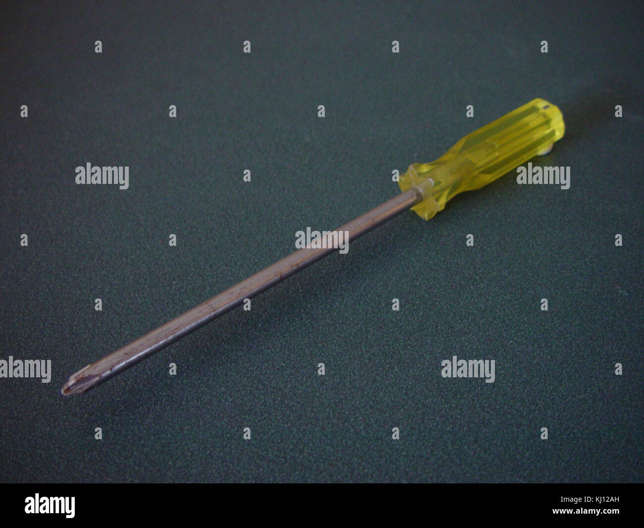 Philips plus or cross screwdriver on table Stock Photo - Alamy