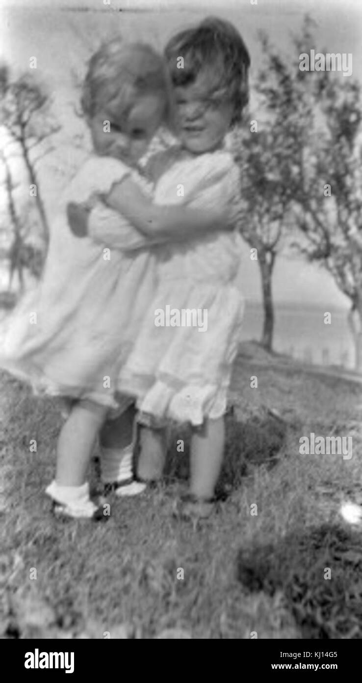 Two girls hugging Stock Photo - Alamy