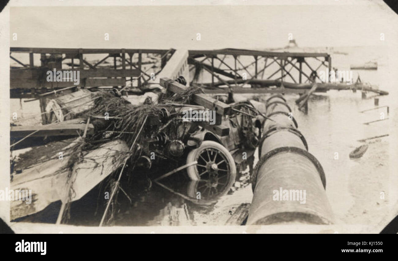 Wreckage of a bridge and car from causeway collapse Stock Photo - Alamy