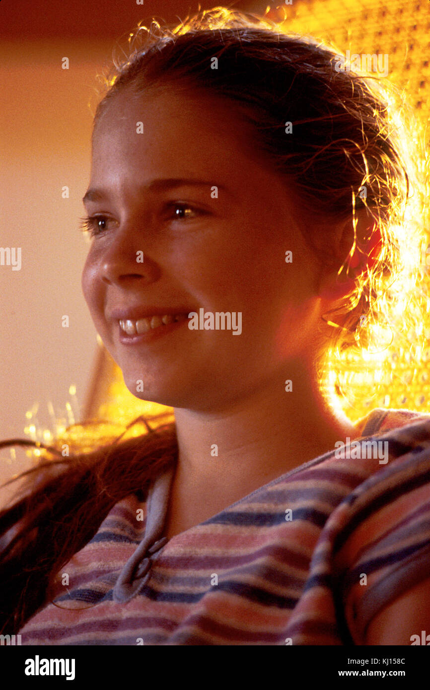 Young female smiling Stock Photo - Alamy