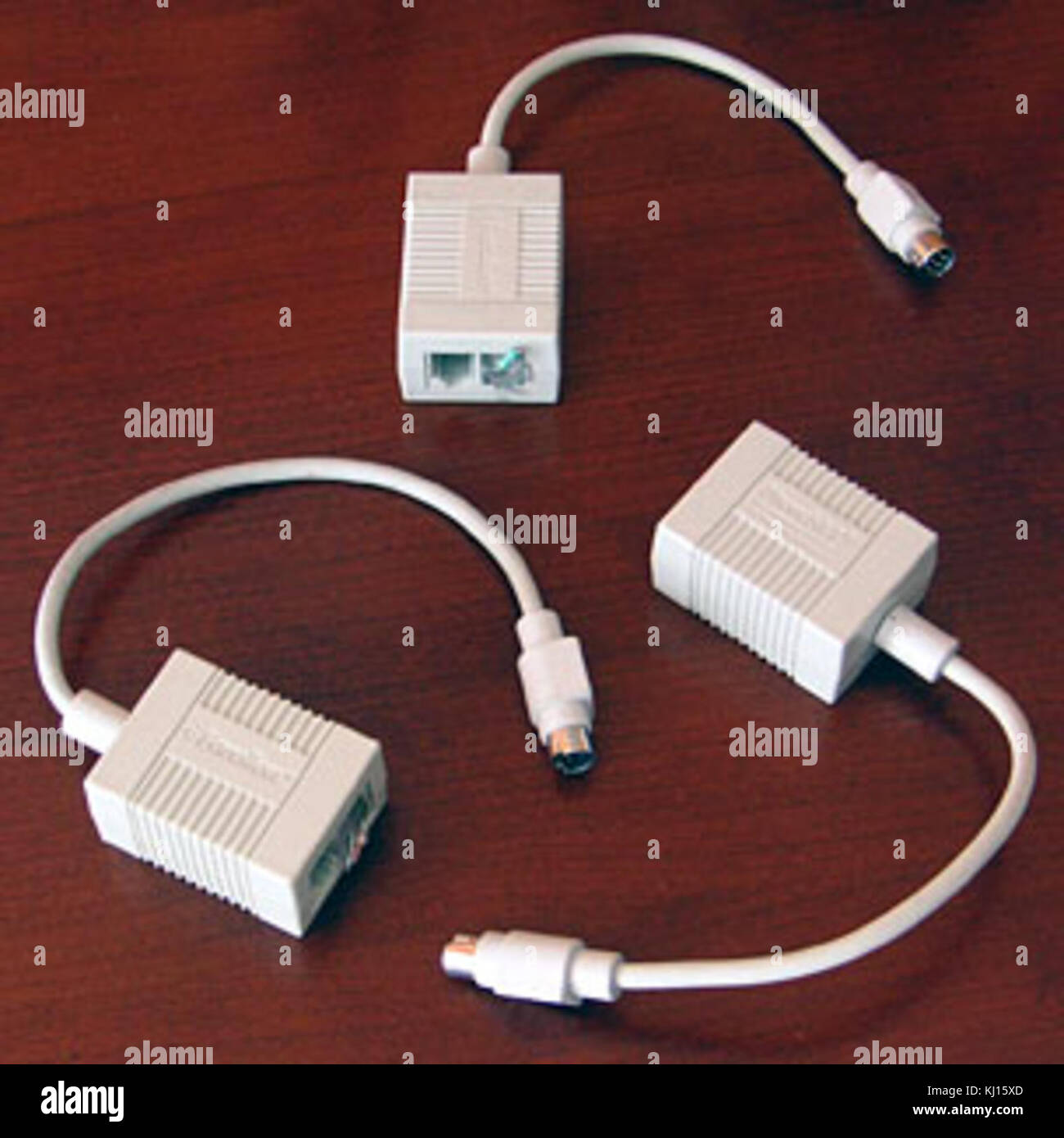 An image of 3 Farallon PhoneNet AppleTalk adapters Stock Photo - Alamy