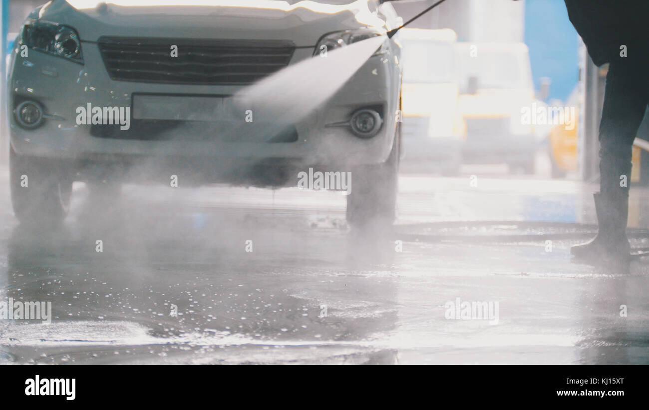 Washing a SUV car in the suds - car service Stock Photo - Alamy