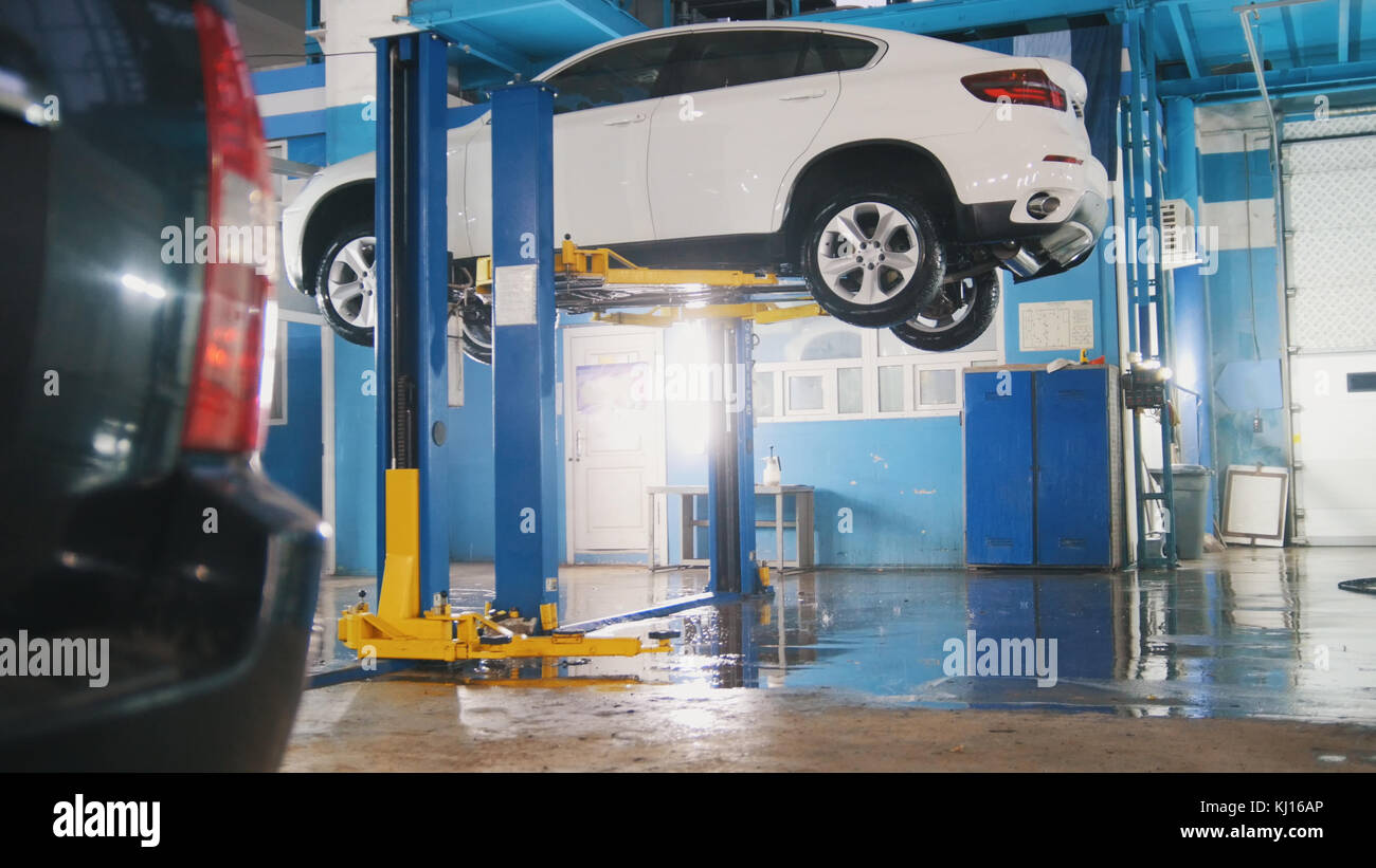 Luxury SUV in professional car service workshop Stock Photo - Alamy