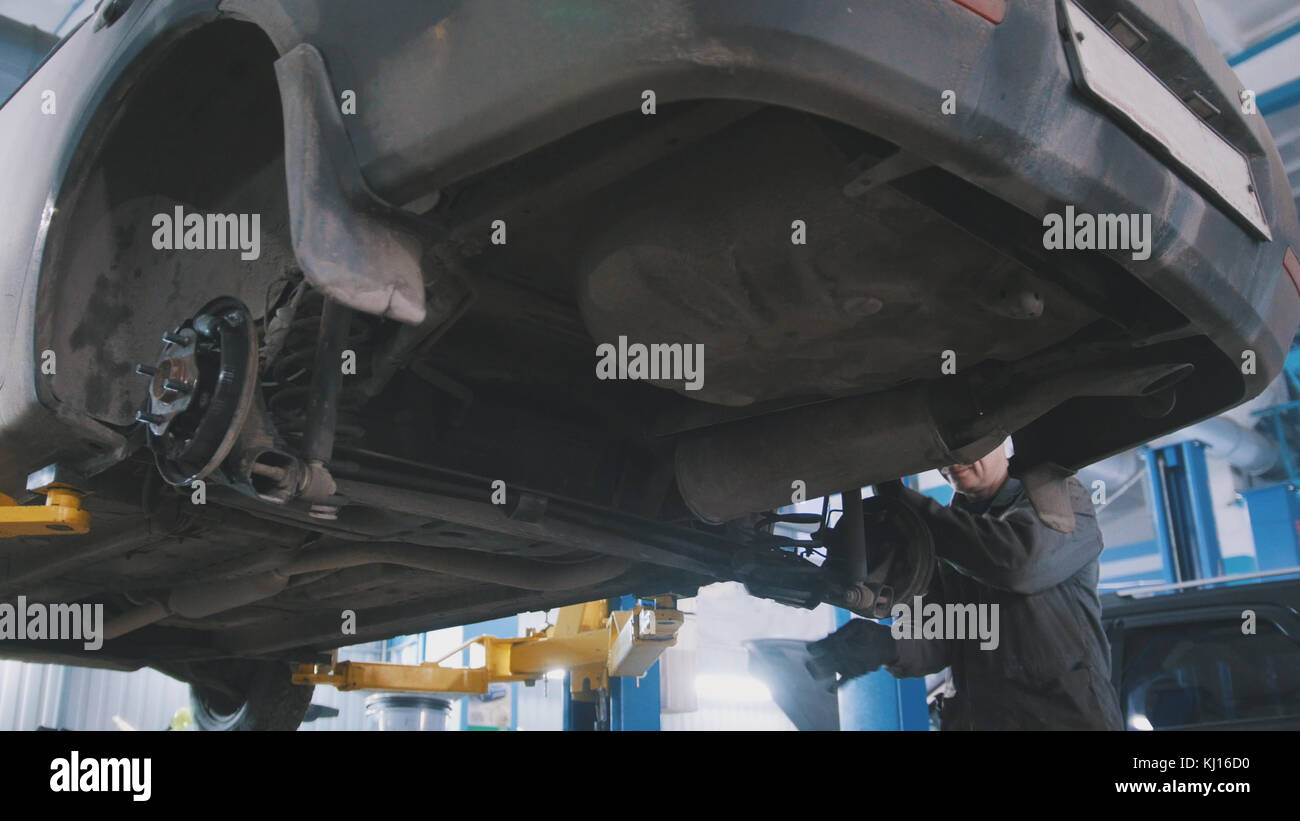 Motor mechanic looking wheels hi-res stock photography and images - Alamy