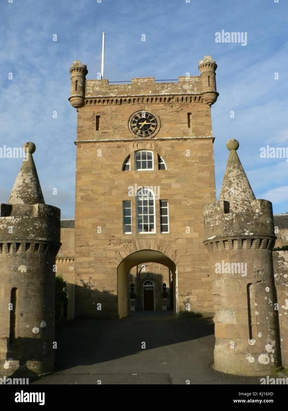 This photograph shows the entrance to a historic castle. The castle is ...
