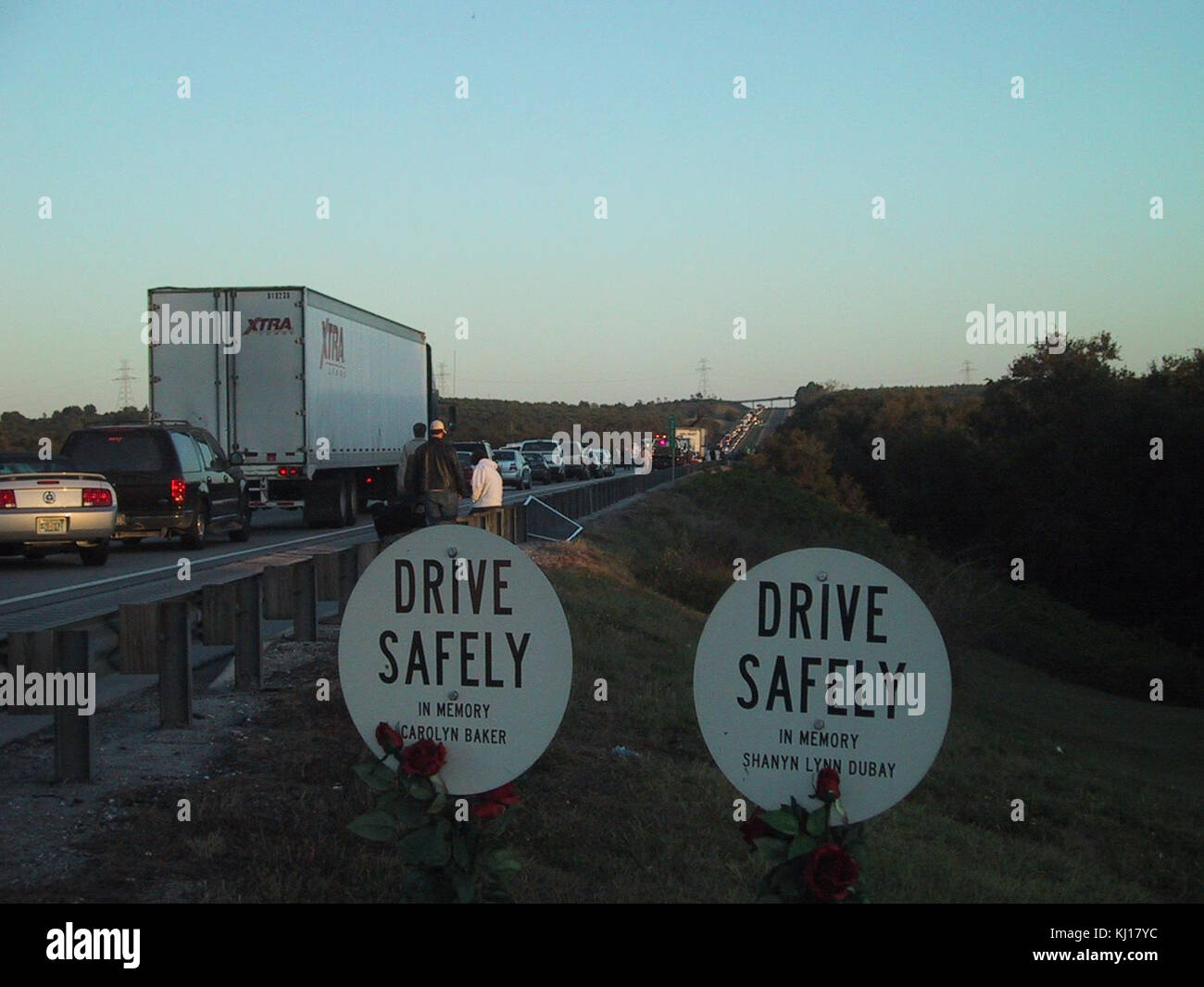 Drive safely signs in front of accident Stock Photo - Alamy