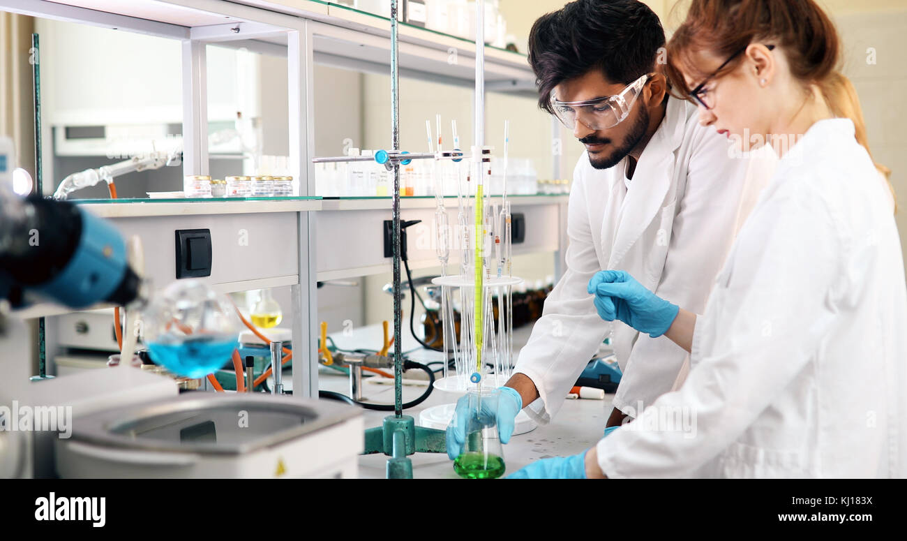 Young students of chemistry working in laboratory Stock Photo - Alamy