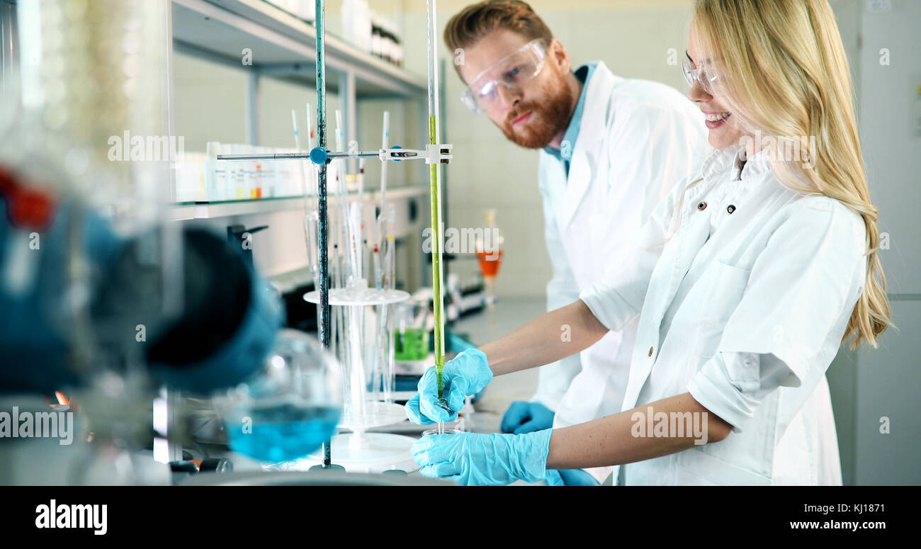 Young students of chemistry working in laboratory Stock Photo - Alamy