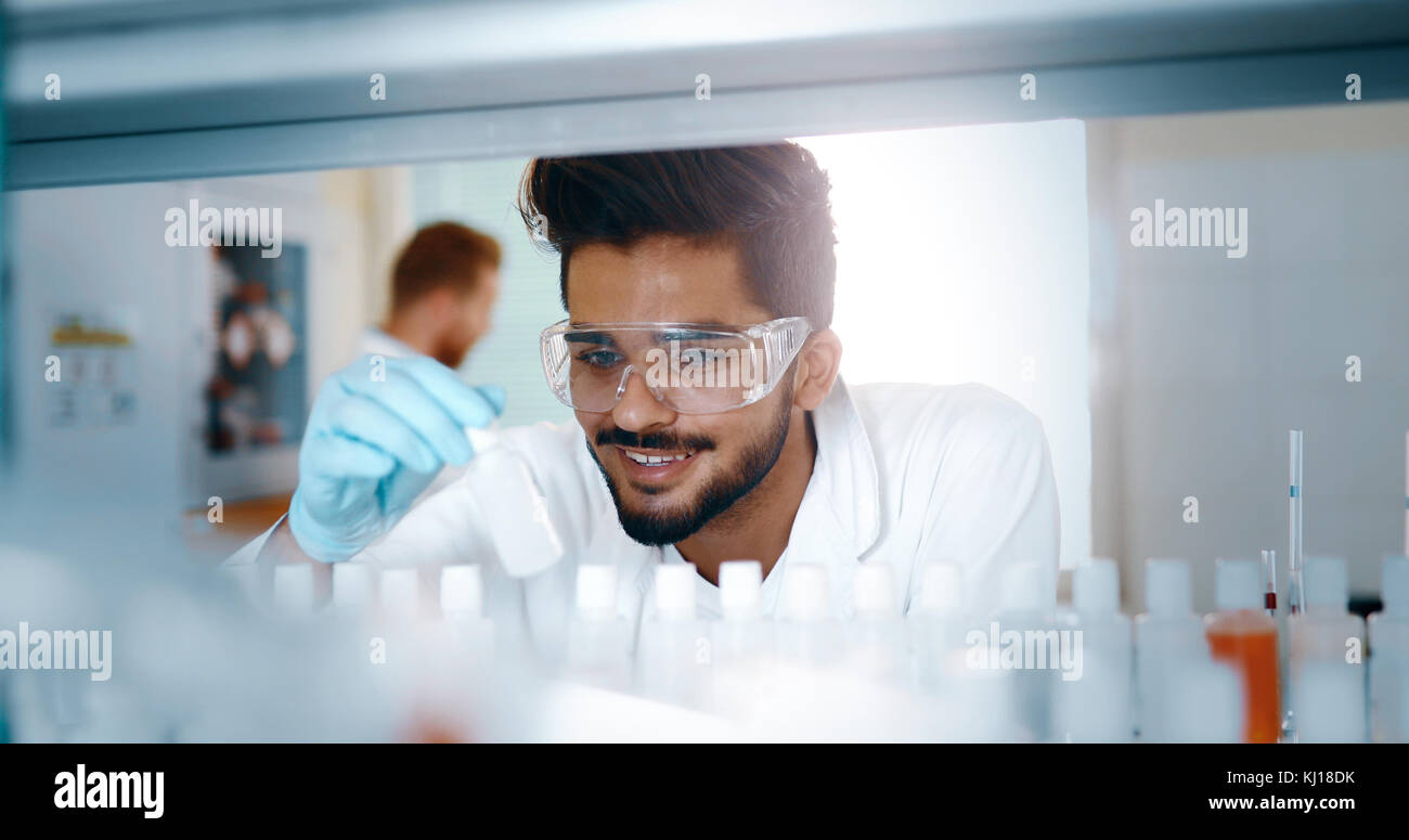 Male student of chemistry working in laboratory Stock Photo - Alamy