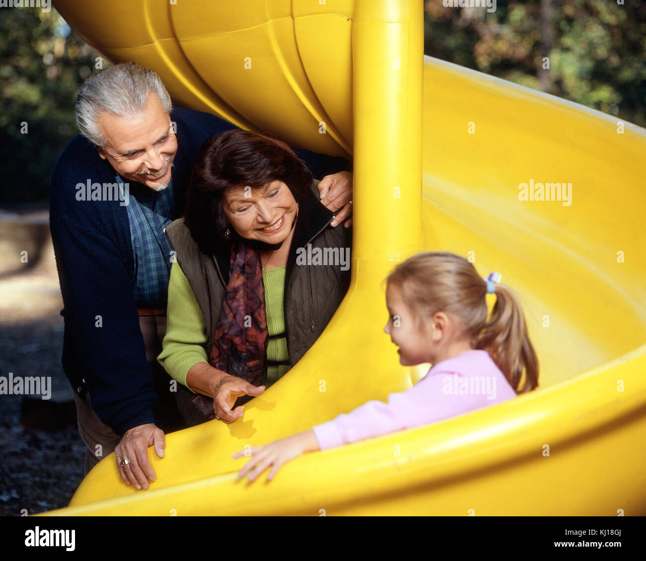 Family at a playground (2 Stock Photo - Alamy
