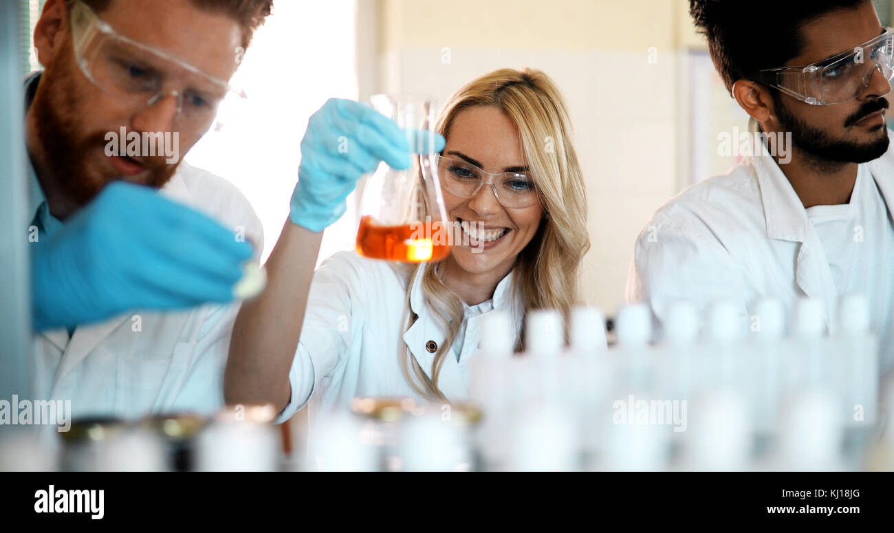 Group of chemistry students working in laboratory Stock Photo - Alamy