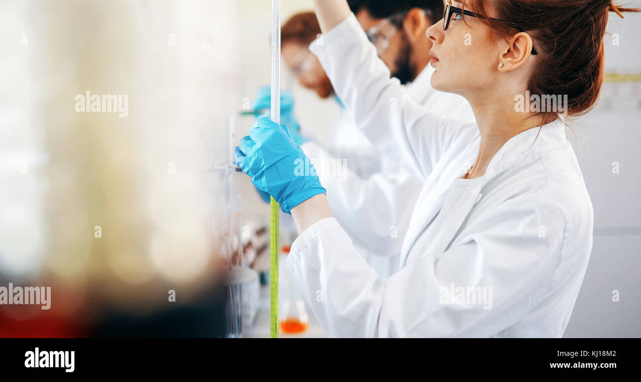 Young students of chemistry working in laboratory Stock Photo - Alamy