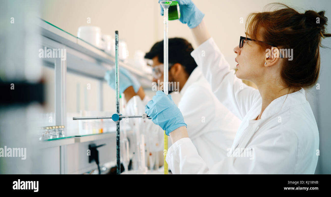 Young students of chemistry working in laboratory Stock Photo - Alamy