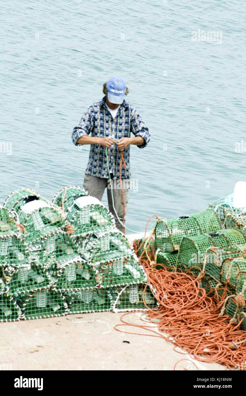 Fisherman preparing net Stock Photo - Alamy
