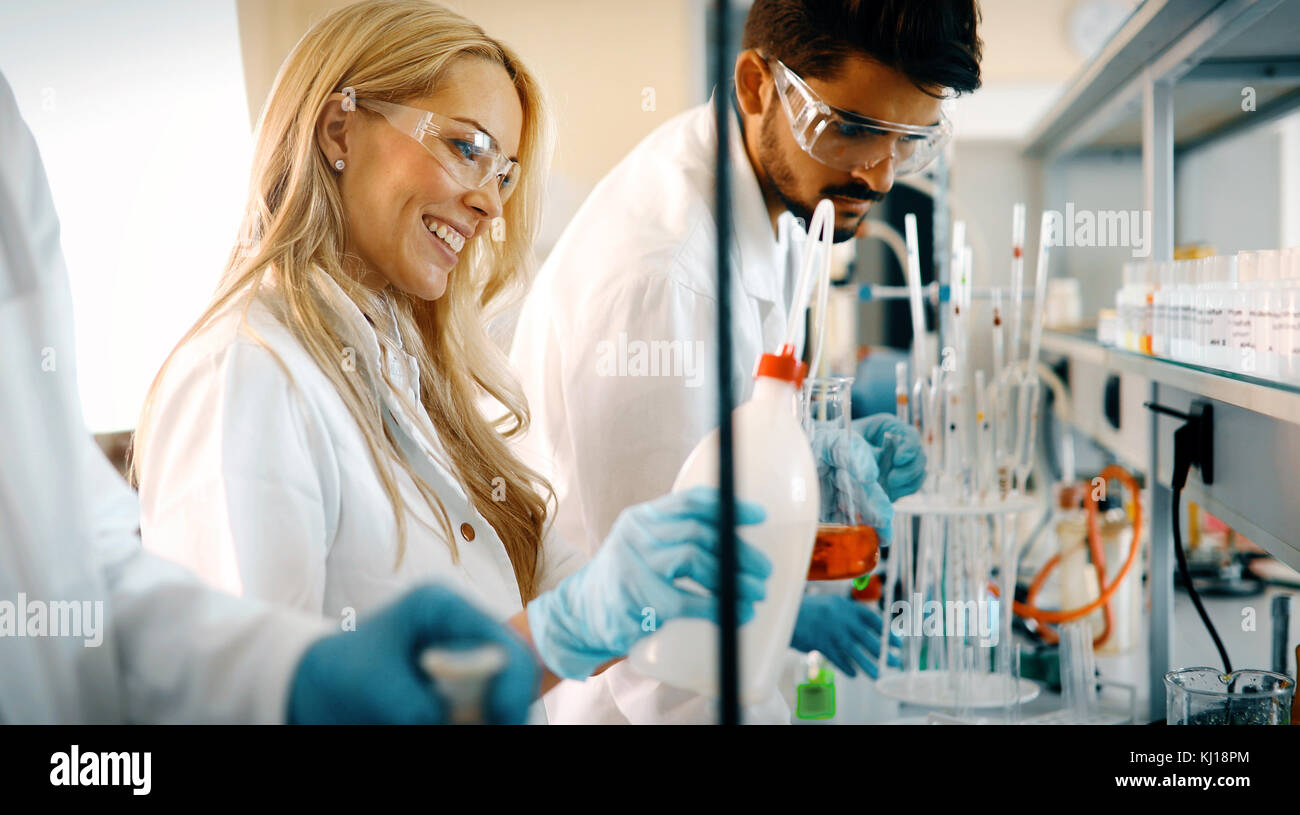 Attractive student of chemistry working in laboratory Stock Photo - Alamy