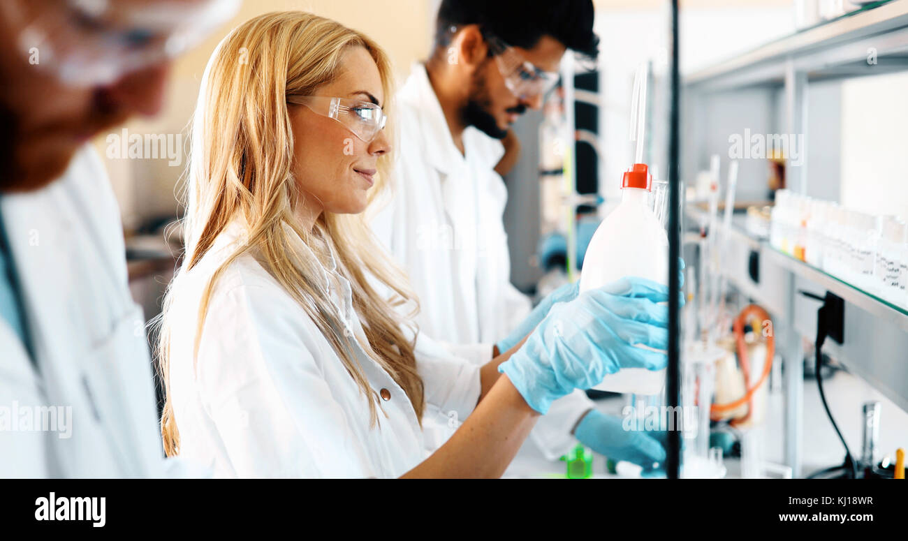 Young students of chemistry working in laboratory Stock Photo - Alamy