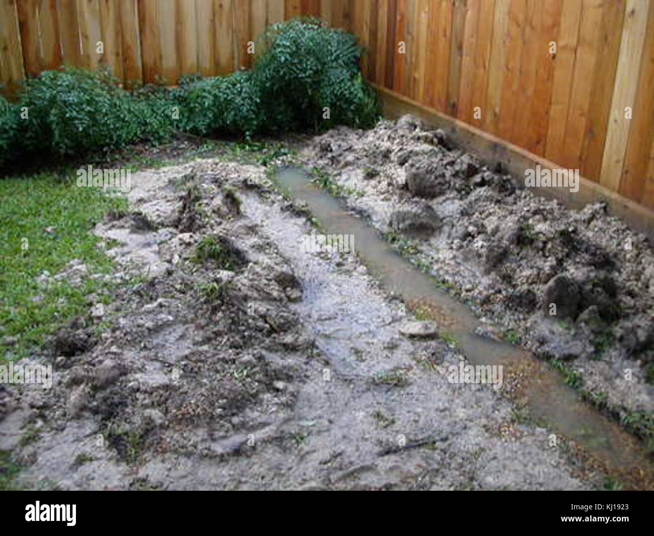 A French drain, a type of drainage system, designed to redirect water ...