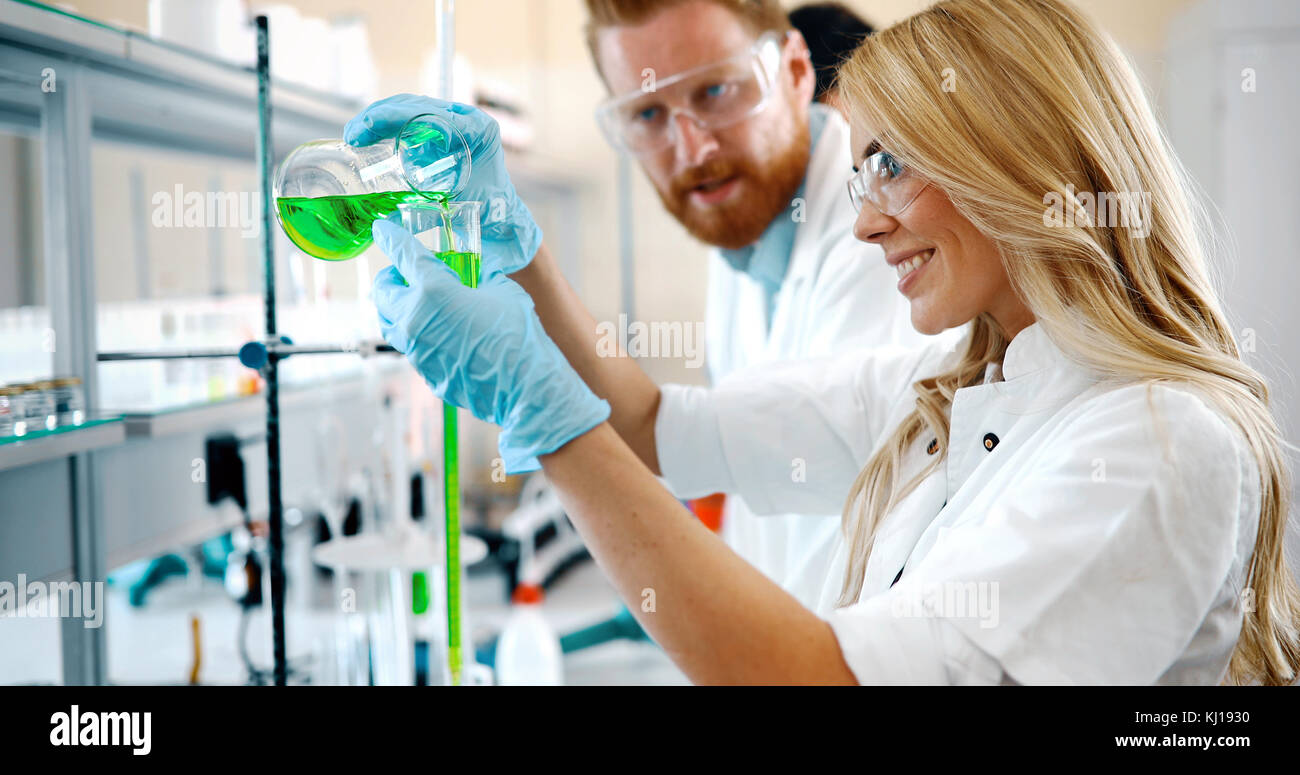 Group of chemistry students working in laboratory Stock Photo - Alamy