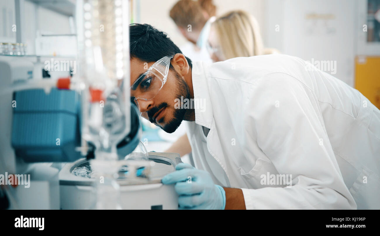 Young students of chemistry working in laboratory Stock Photo - Alamy