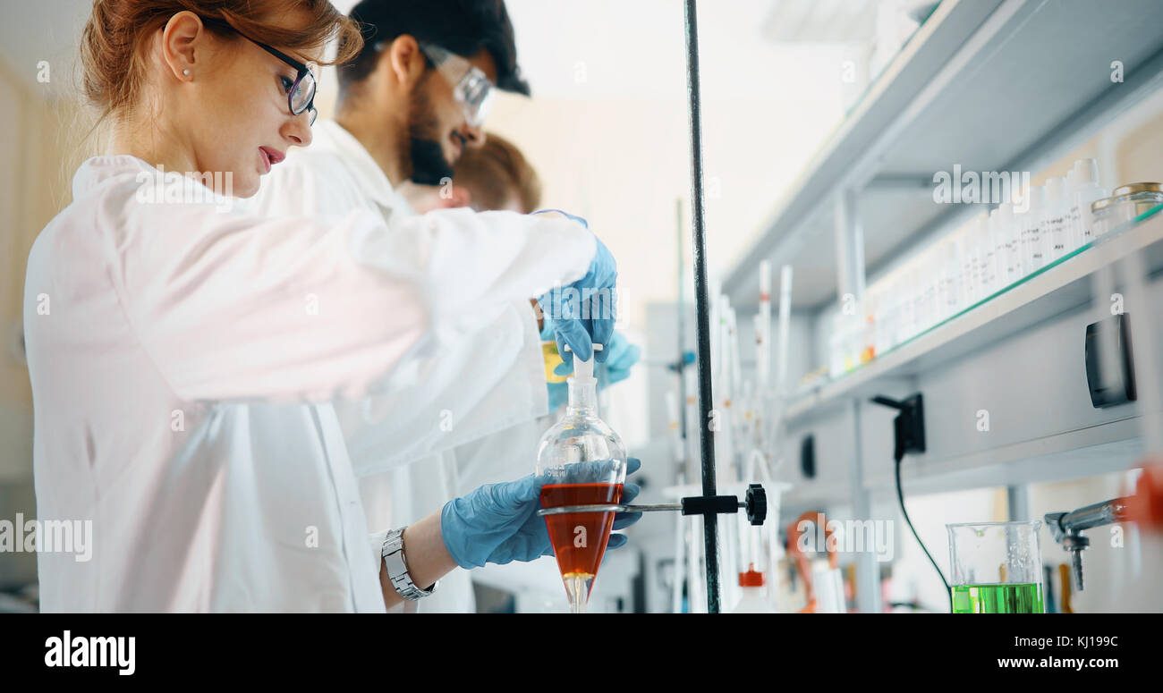Young students of chemistry working in laboratory Stock Photo - Alamy