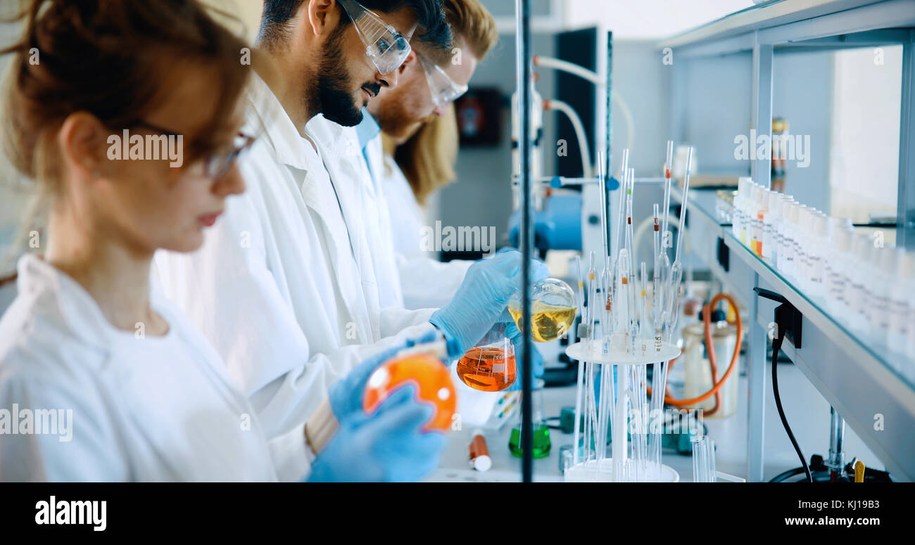 Young students of chemistry working in laboratory Stock Photo - Alamy