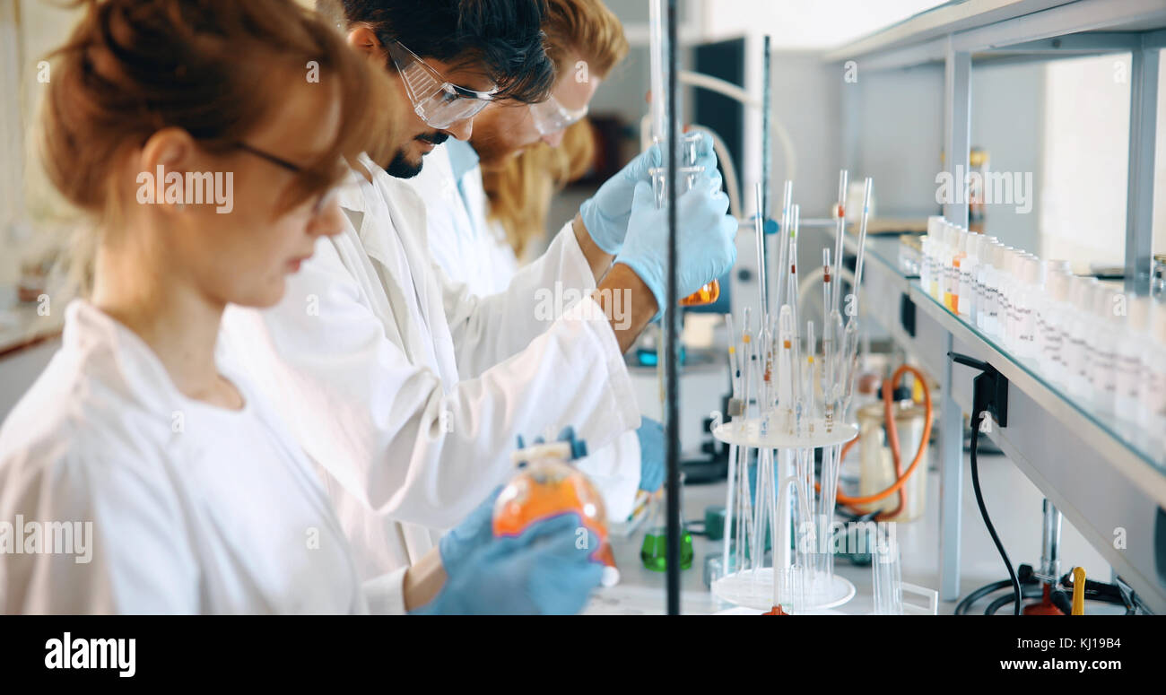 Young students of chemistry working in laboratory Stock Photo - Alamy