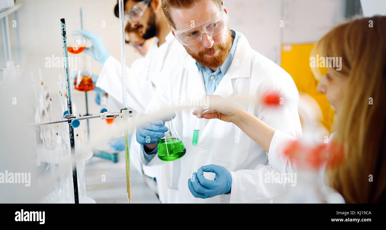 Young students of chemistry working in laboratory Stock Photo - Alamy