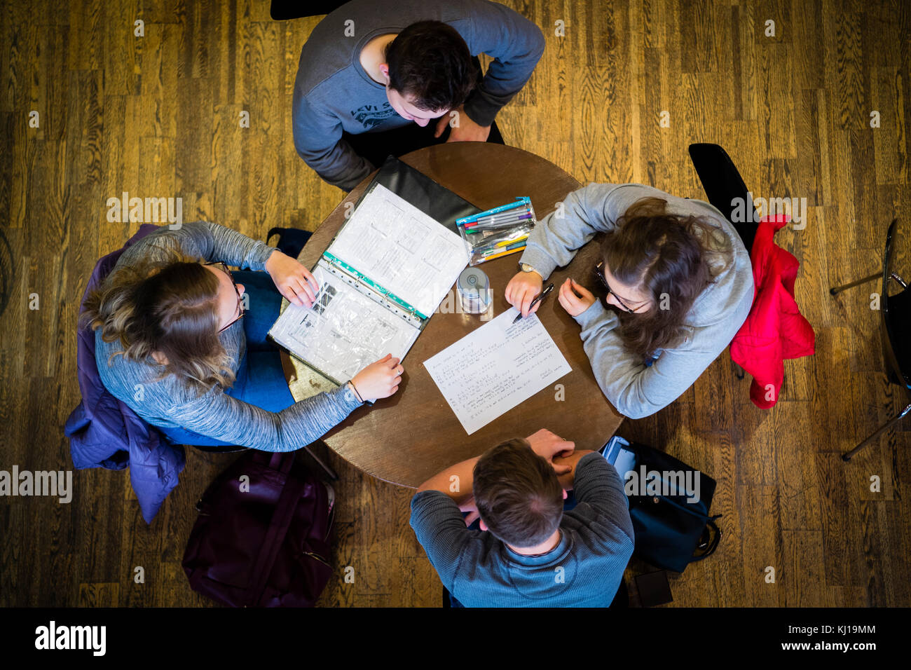 Higher education in the UK: An overhead view of a group of four ...