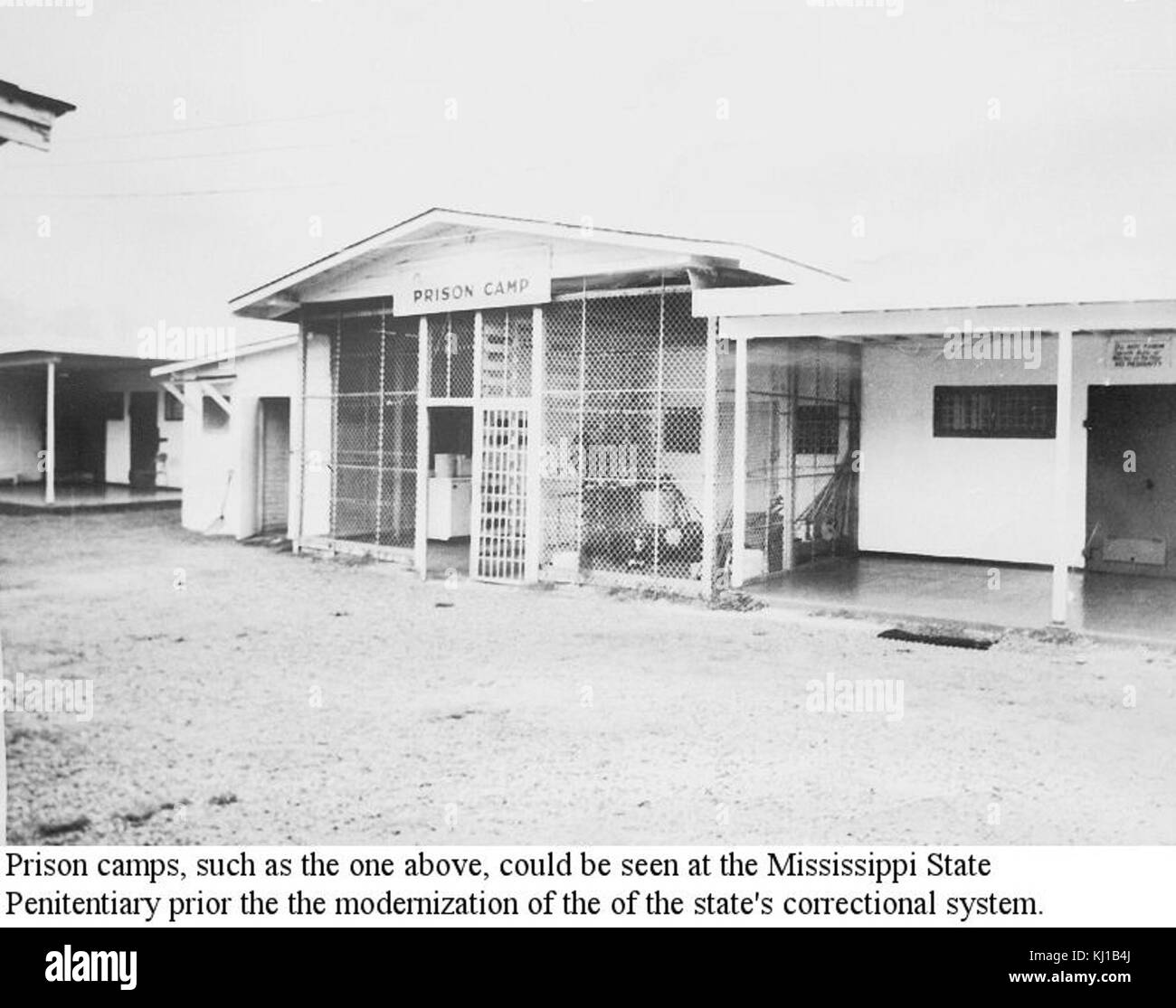 The image depicts a historical prison camp, known for its role in ...