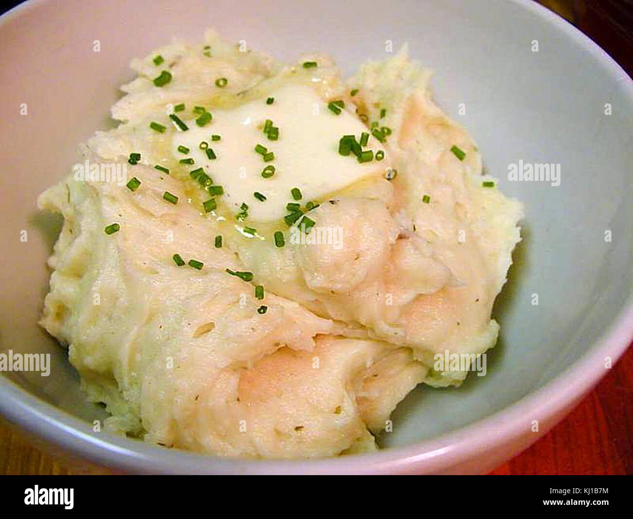Mashed potatoes butter chives food dinner cooking Stock Photo - Alamy
