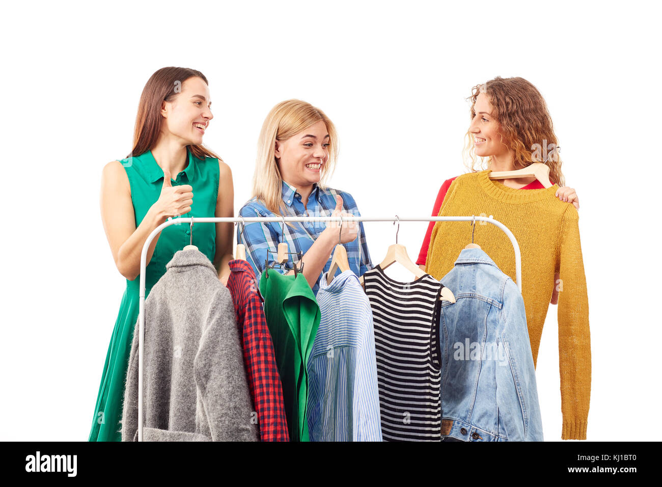 Browsing through clothes Stock Photo - Alamy