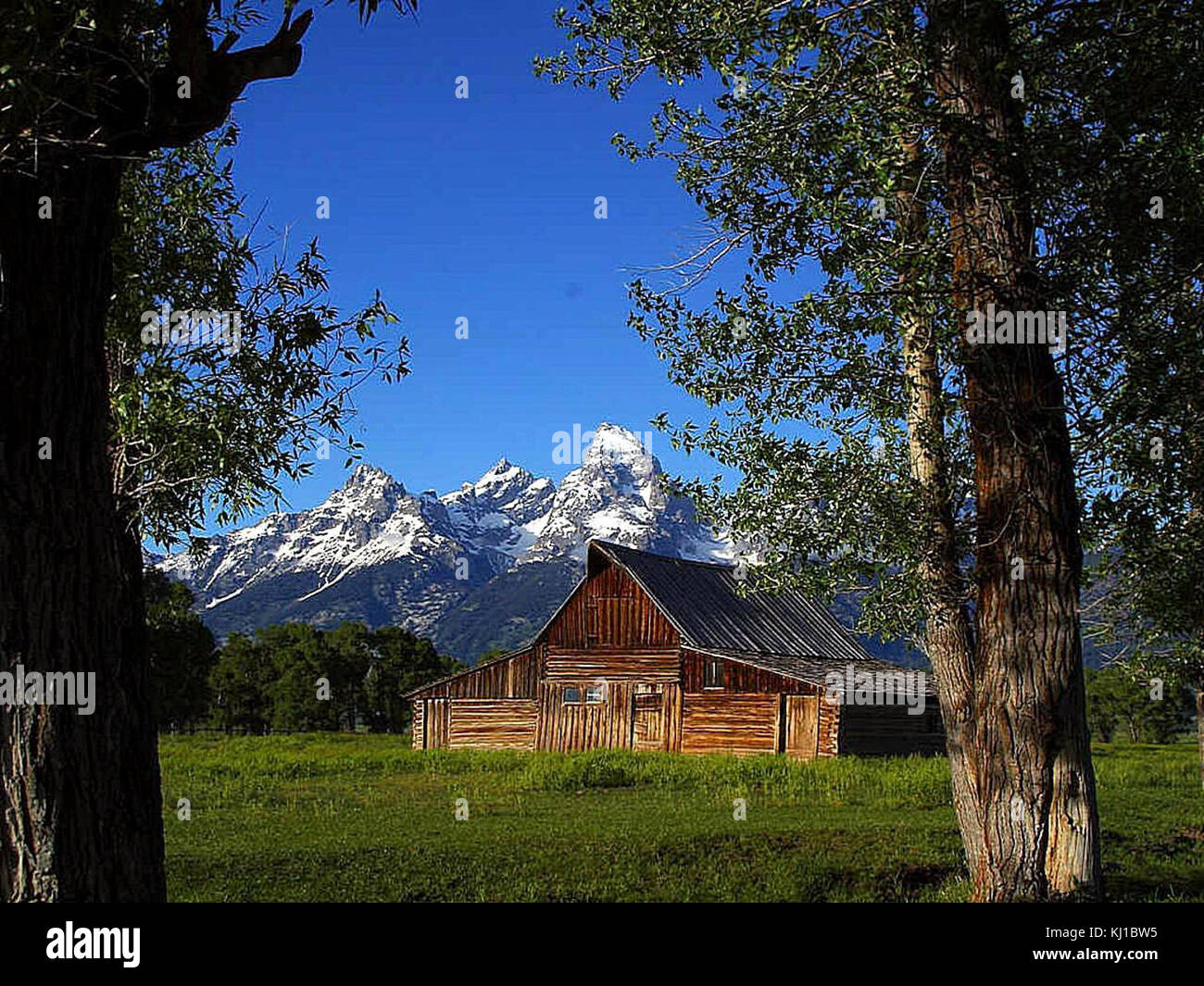 This image shows the iconic Mormon Row barns located in Grand Teton ...