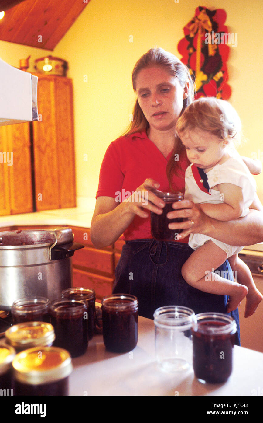 Mother and child canning Stock Photo - Alamy
