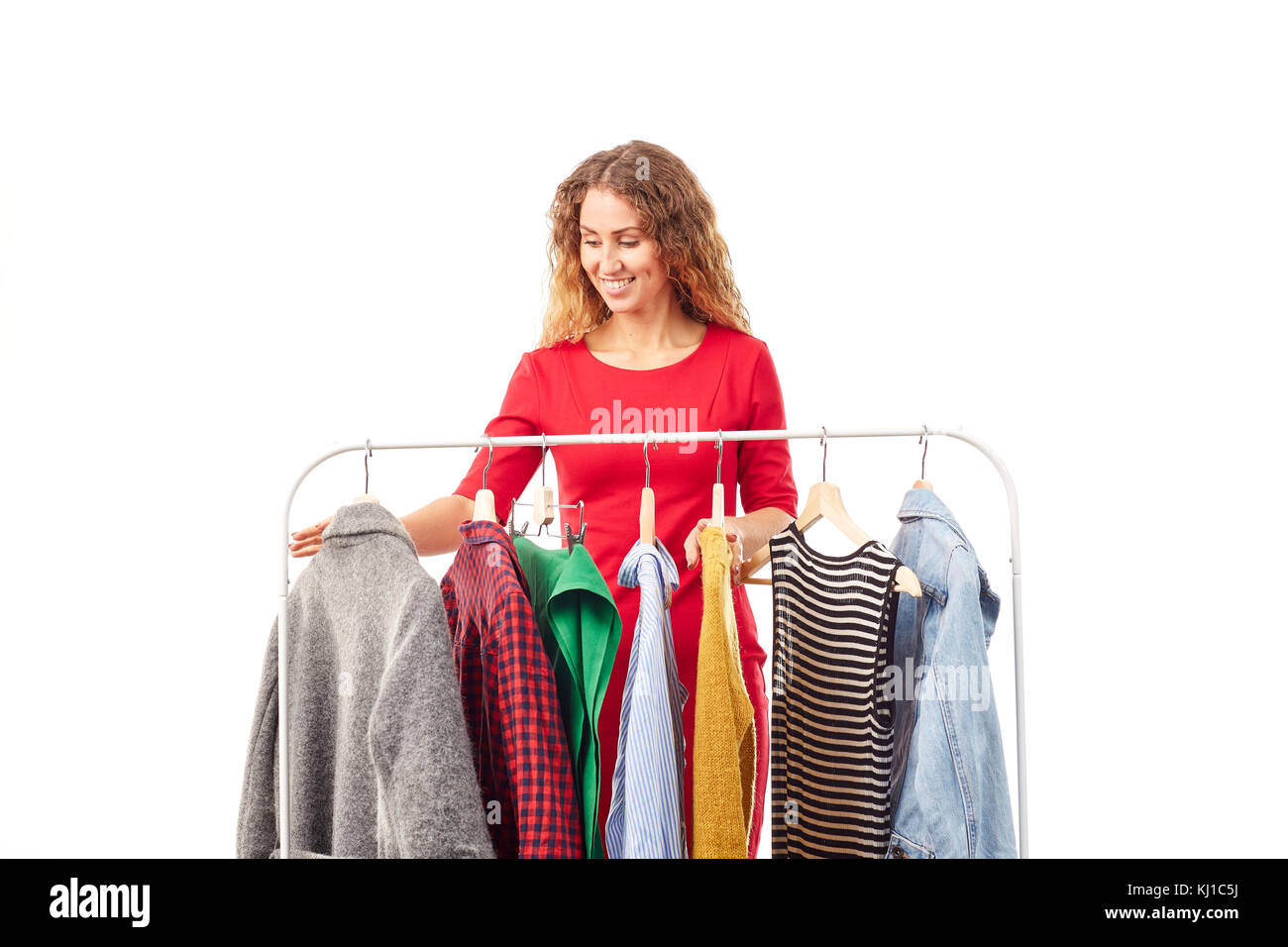 Browsing through clothes Stock Photo - Alamy
