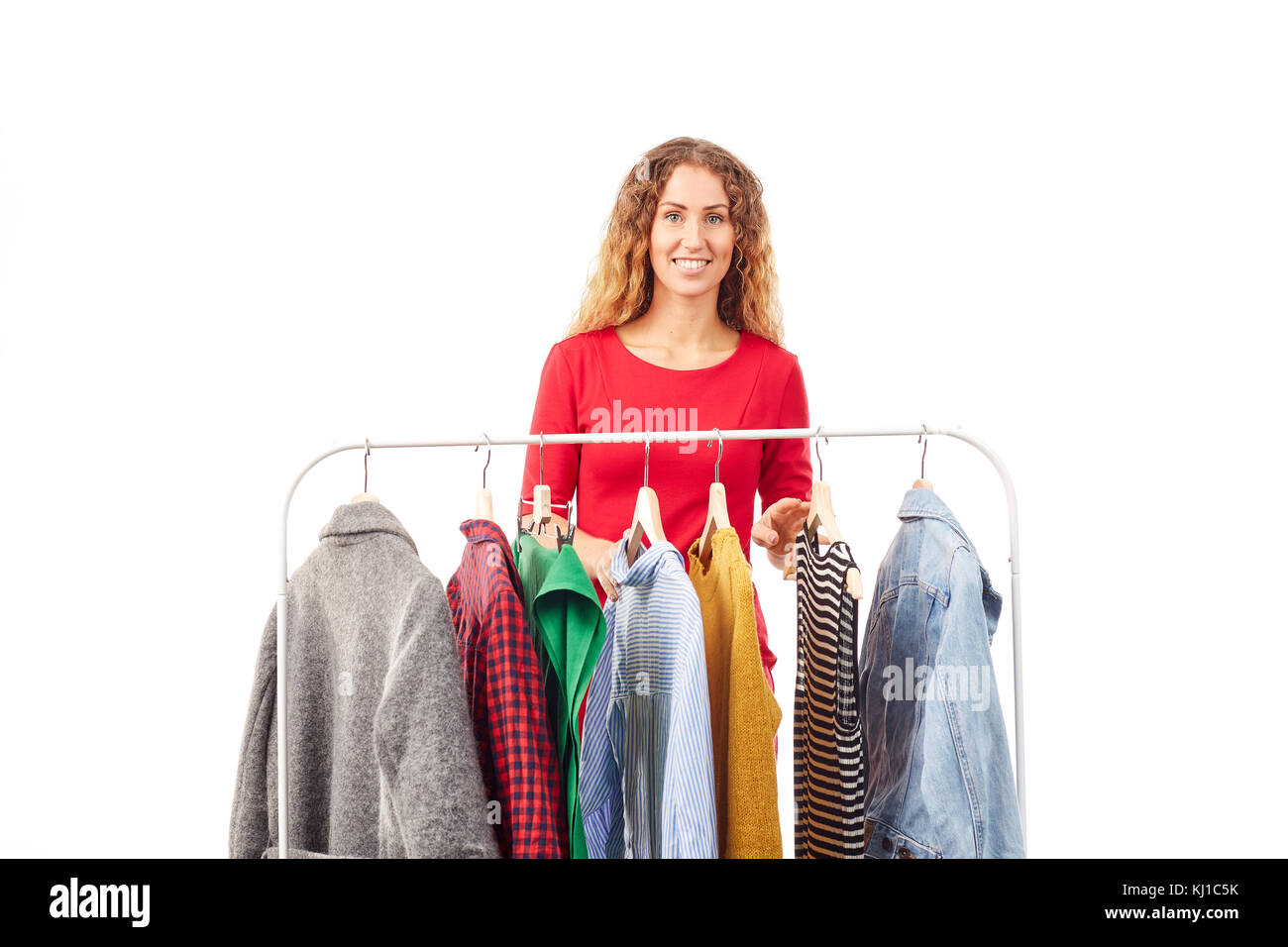Browsing through clothes Stock Photo - Alamy