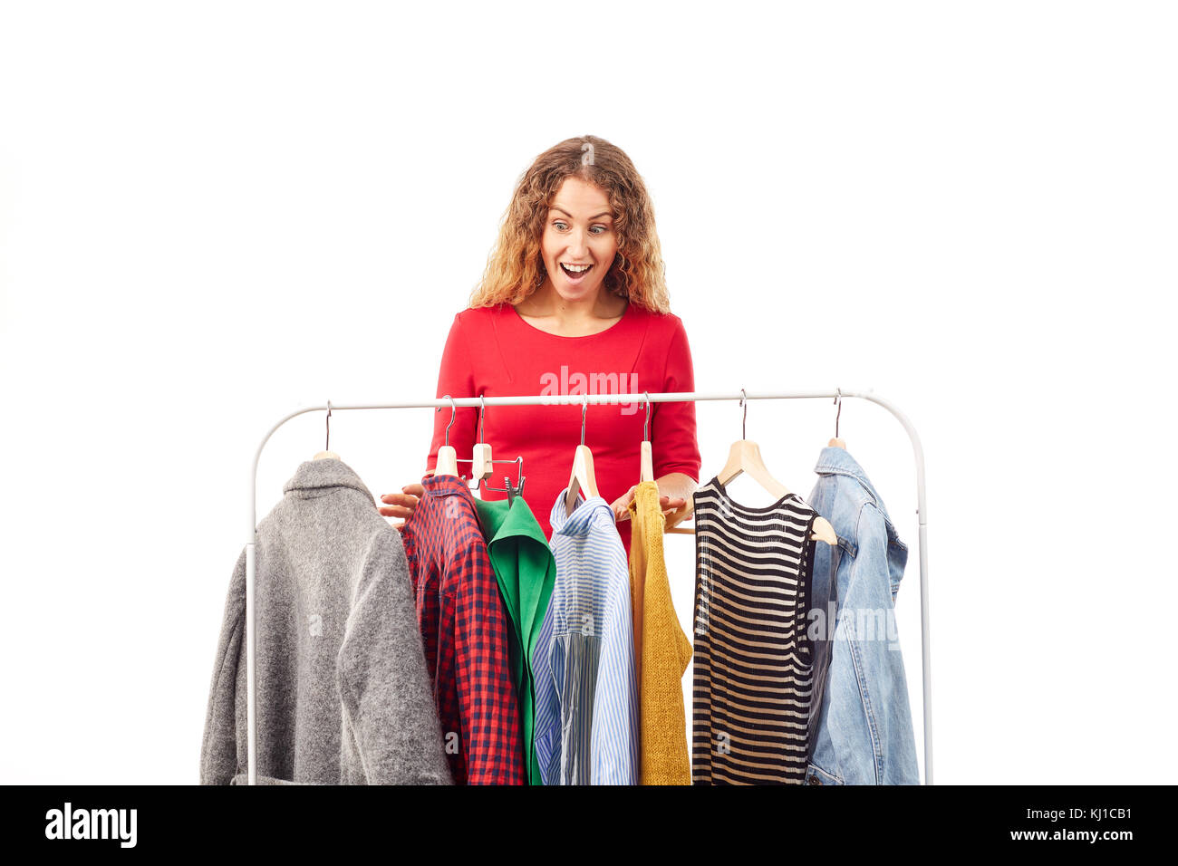 Browsing through clothes Stock Photo - Alamy