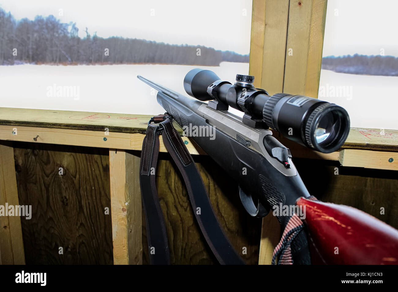 Side view of a rifle in a hunting blind Stock Photo - Alamy