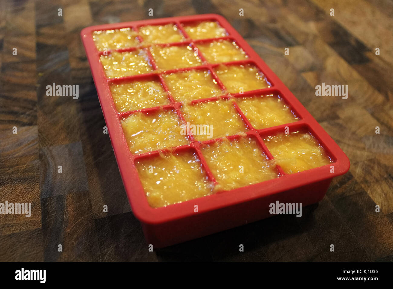 Cooked and pureed peaches about to be frozen Stock Photo - Alamy