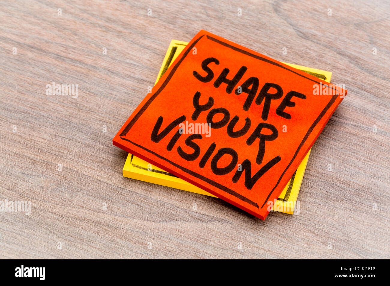 share your vision - handwriting on a sticky note against grained wood ...