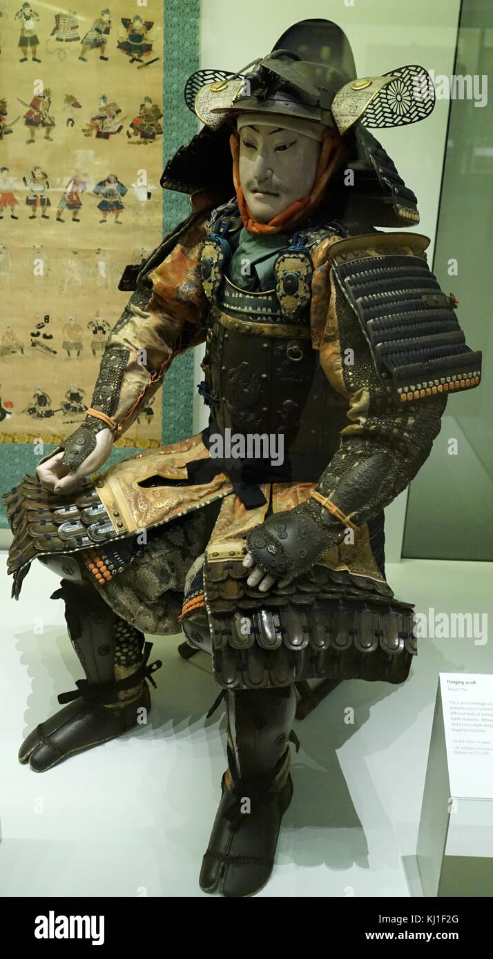 Japanese figure of a samurai dressed in armour. Suit of armour about ...