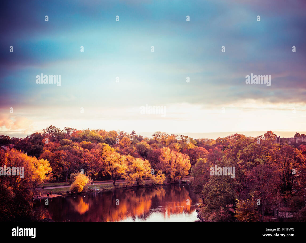 Autumn landscape of City Park with colorful trees , lake and sky at ...