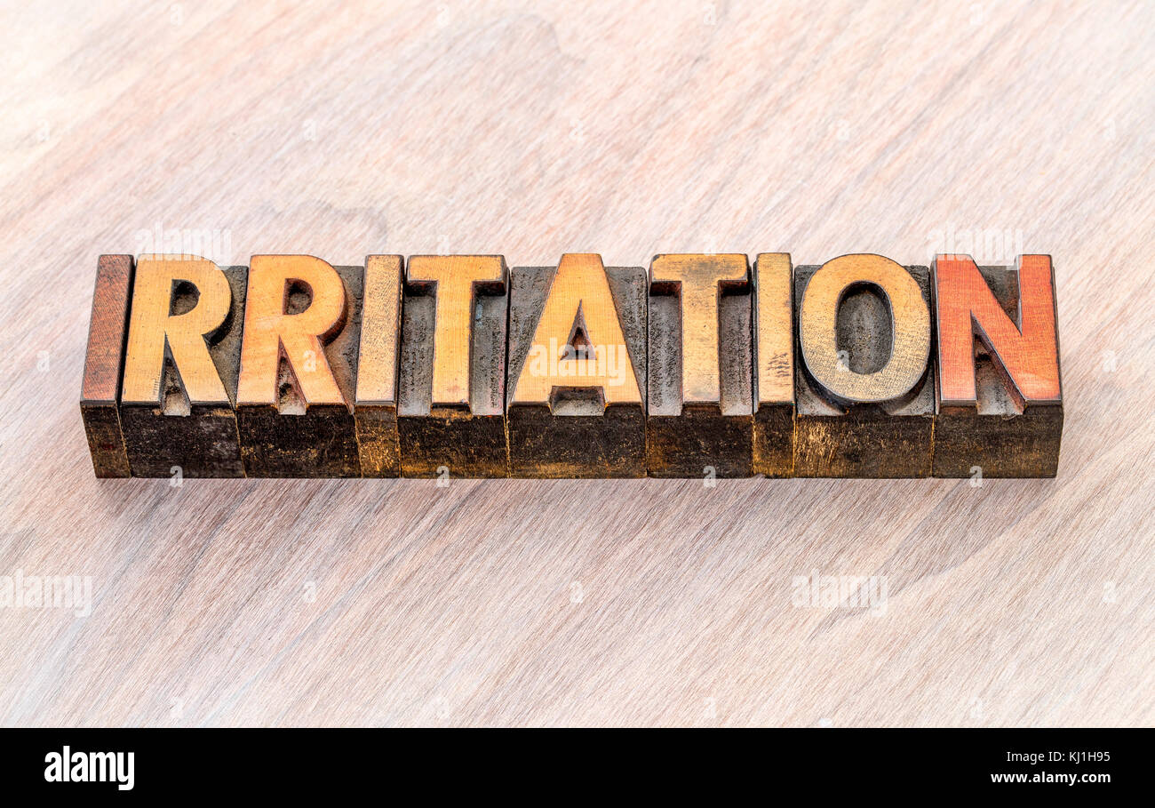 irritation word abstract in vintage letterpress wood type Stock Photo ...