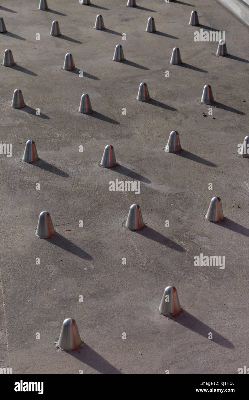 Anti-homeless spikes and rough surfaces installed in a luxury housing ...