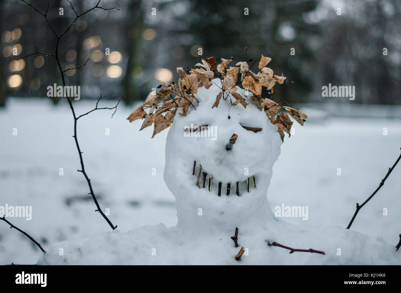 smiling creative funny snowman portrait in winter park in daytime in ...