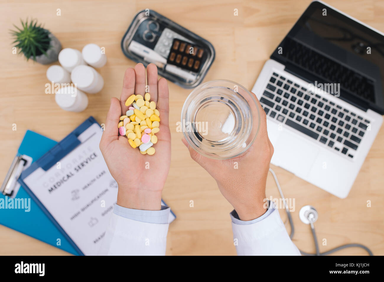 Male doctor hand holding different colorful capsule. Medical treatment ...