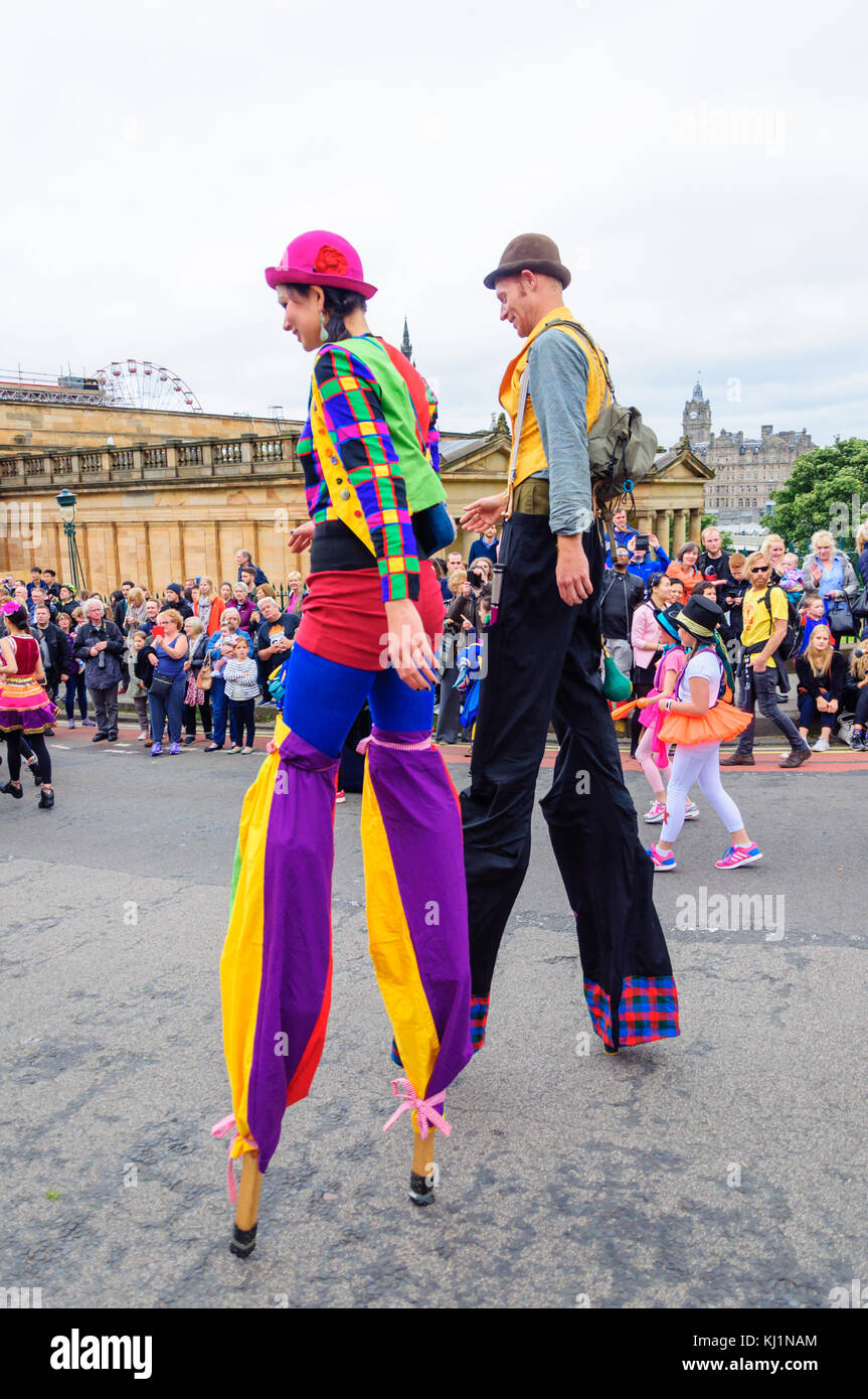 Male & female stilt walkers in the Carnival of The Edinburgh Jazz and ...