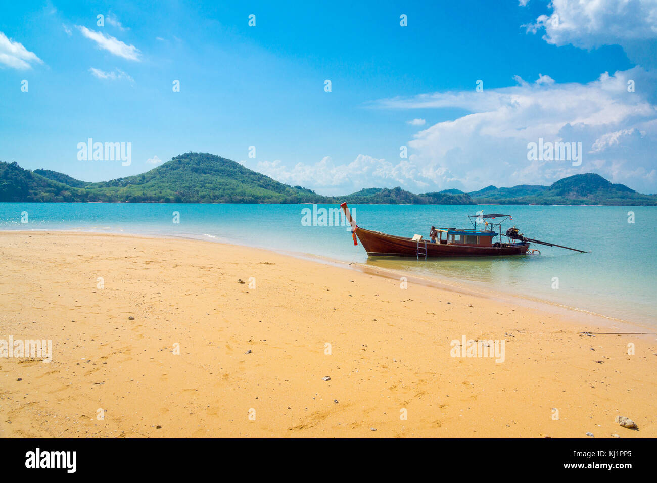 Traditional longtail boat near tropical island Stock Photo - Alamy